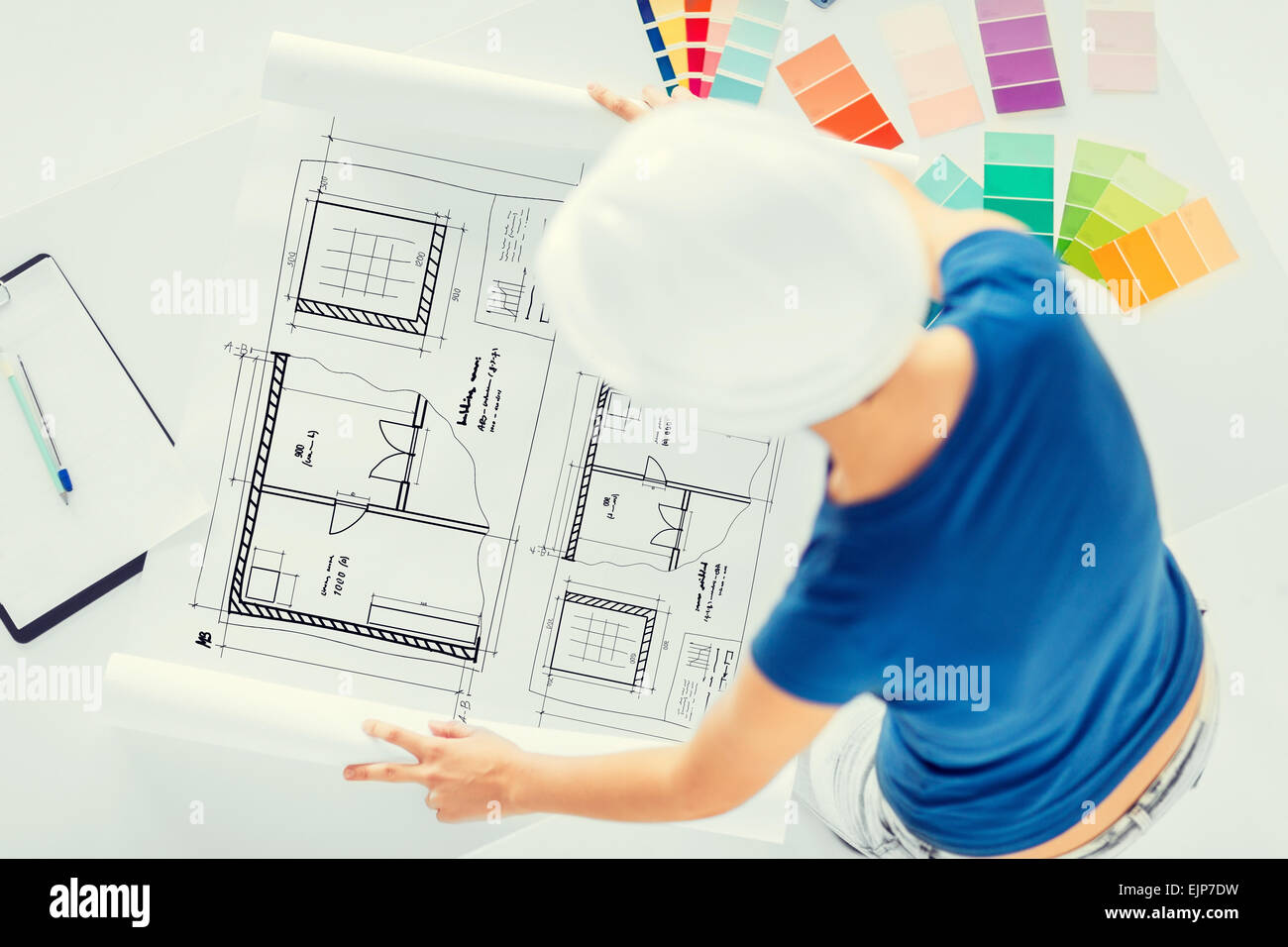woman with color samples and blueprint Stock Photo - Alamy