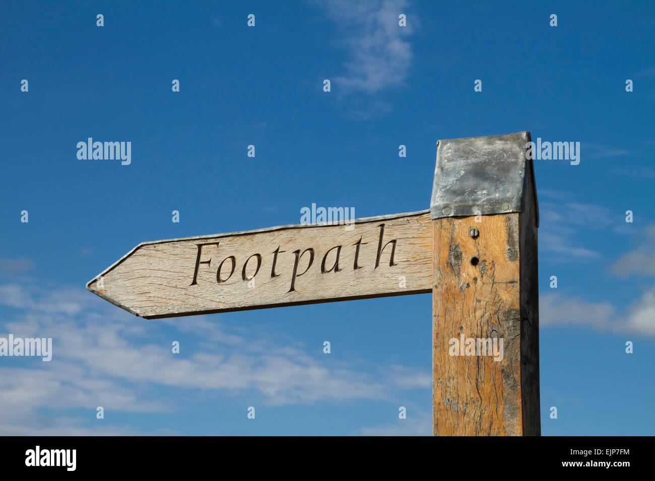 Footpath sign against blue sky Stock Photo - Alamy