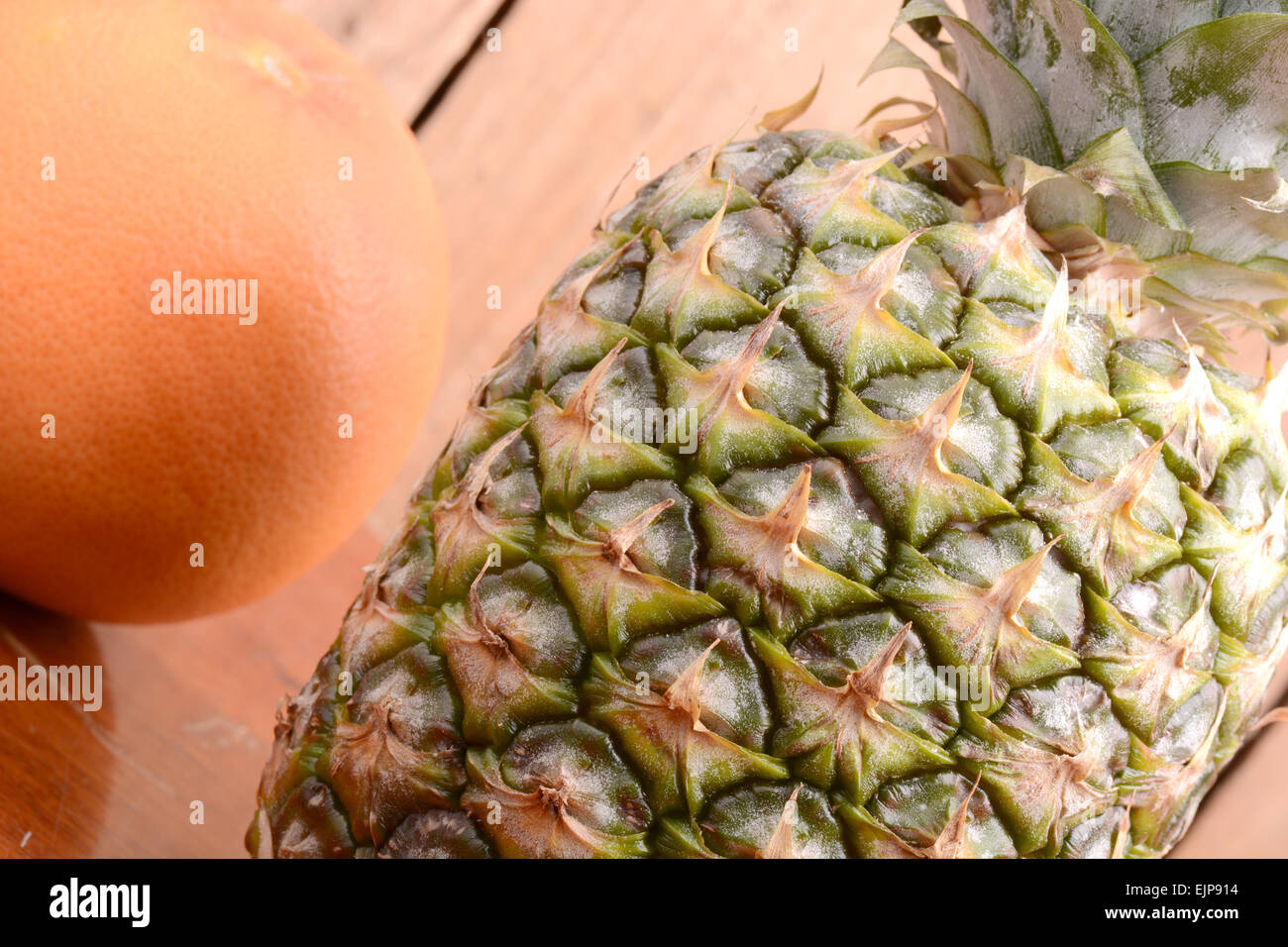 fresh pineapple with orange Stock Photo - Alamy