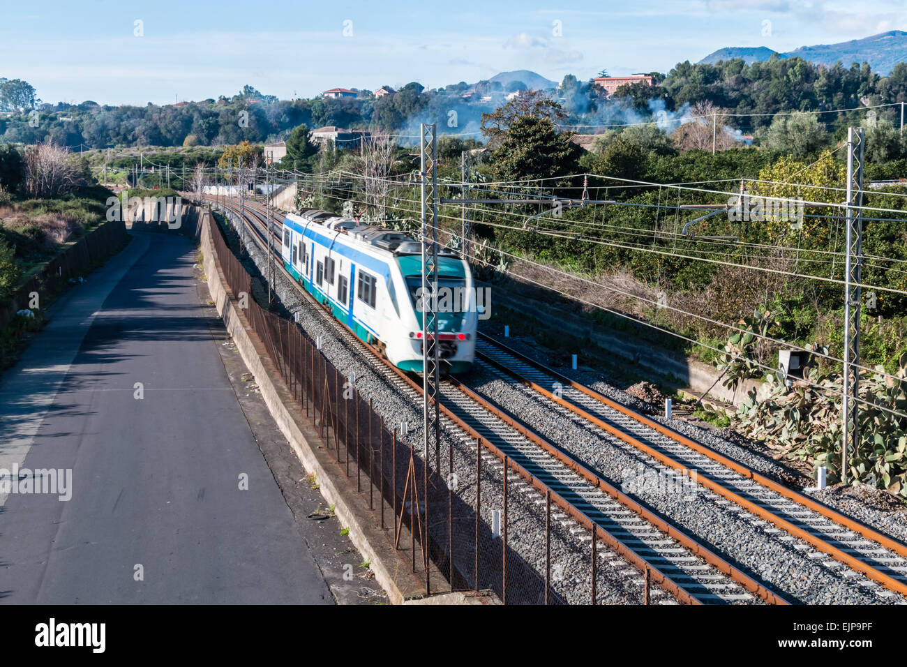 train on the tracks that whizzes fast Stock Photo - Alamy