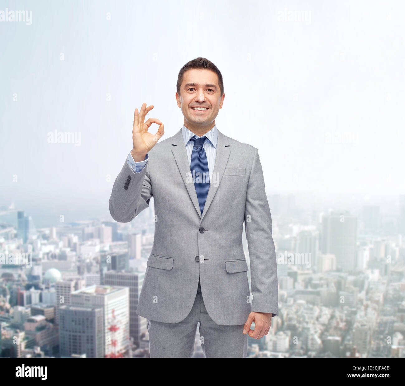happy businessman in suit showing ok hand sign Stock Photo - Alamy