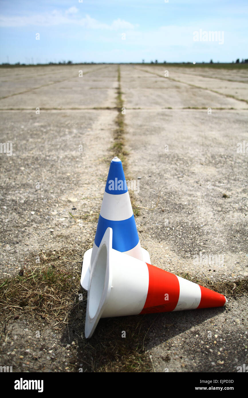 Two cones, red and blue, on the road Stock Photo - Alamy