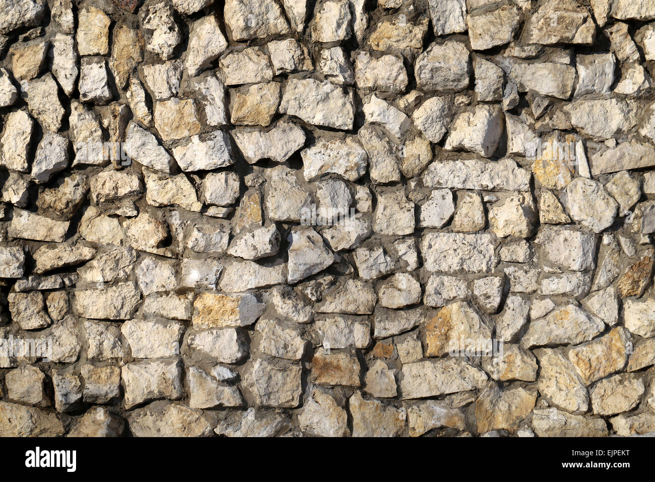 beautiful bright background textured wall of rough stones Stock Photo ...