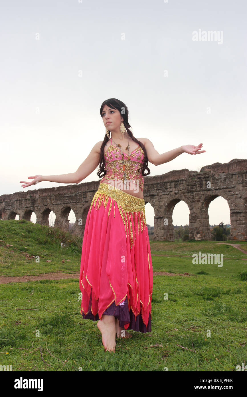 belly dancer with ancient Roman aqueducts ruins Stock Photo - Alamy