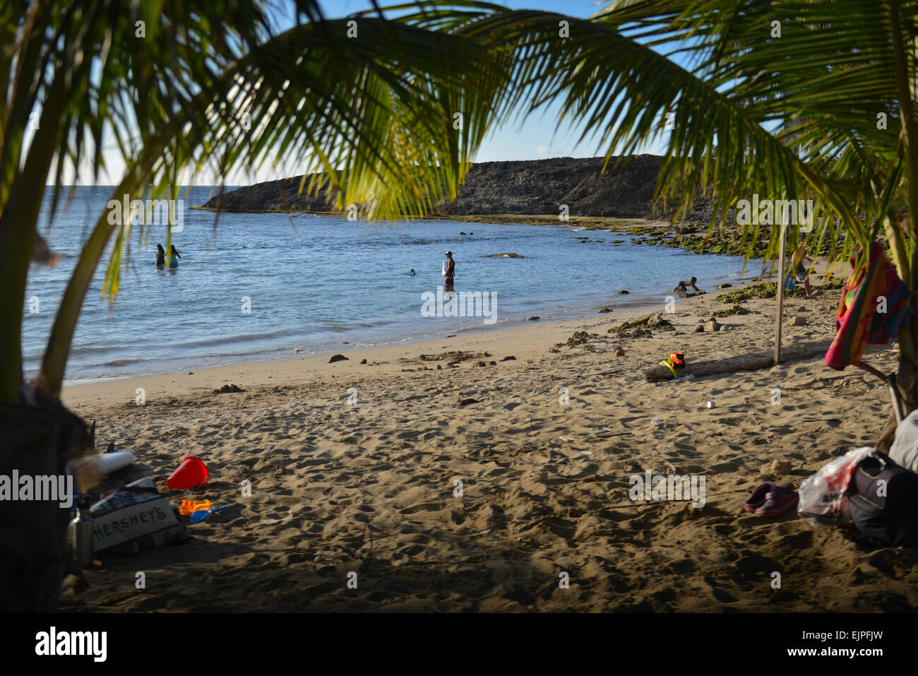 Beach goers enjoying the final hours before the sundown at Jobos beach ...