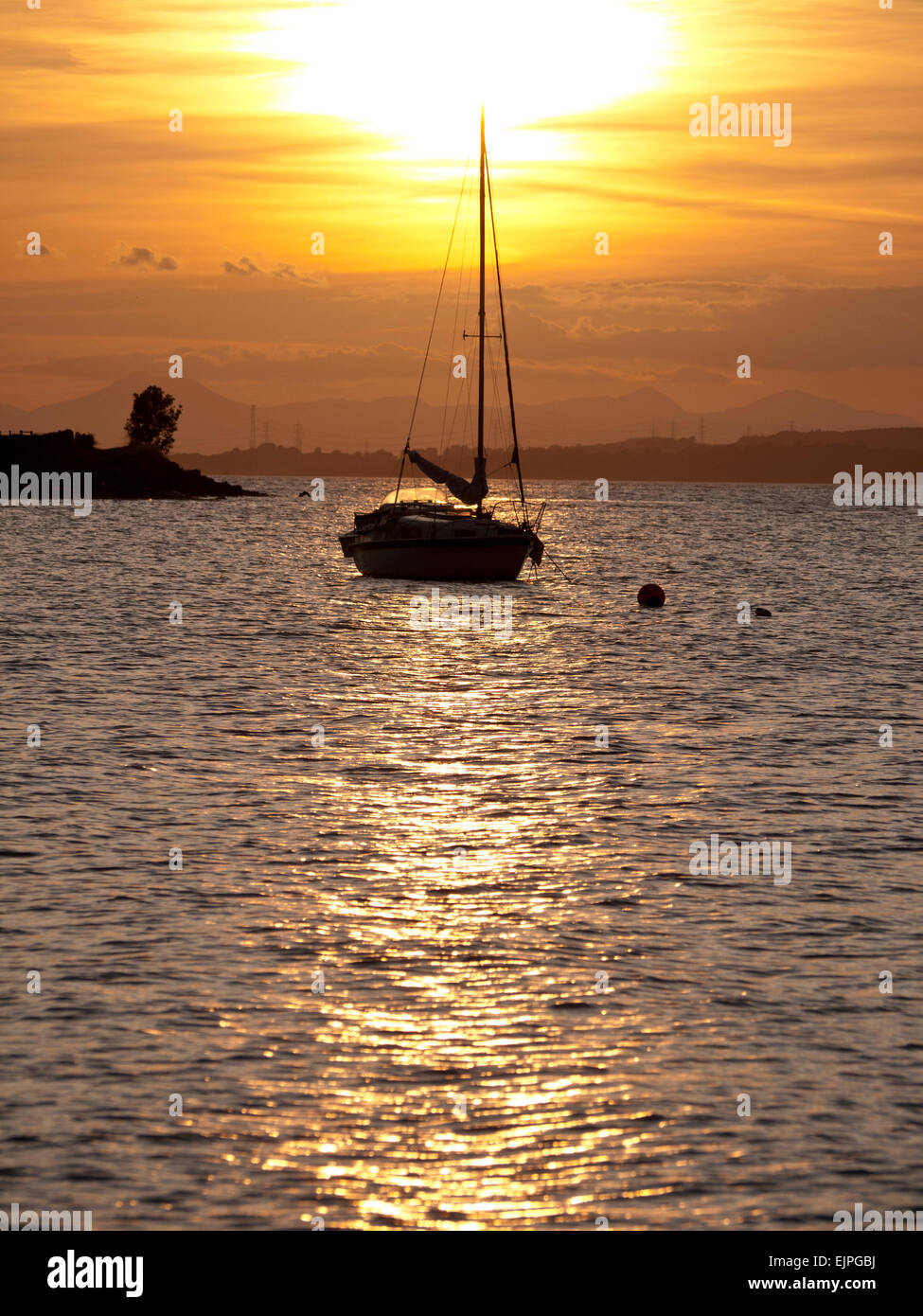 Boat in sunset Stock Photo - Alamy