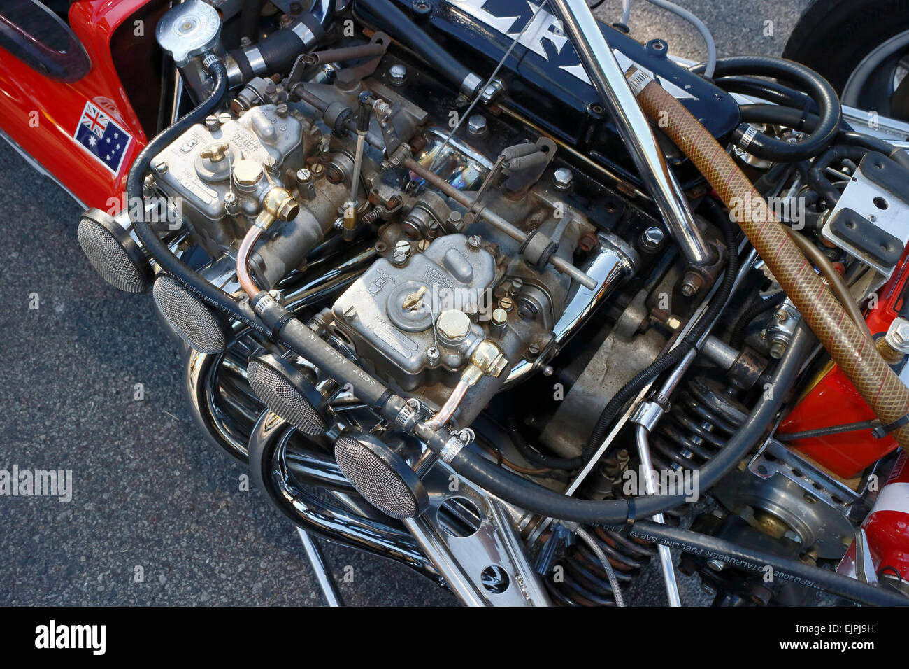 Weber carburretors attached to the engine of a classic open wheeler ...