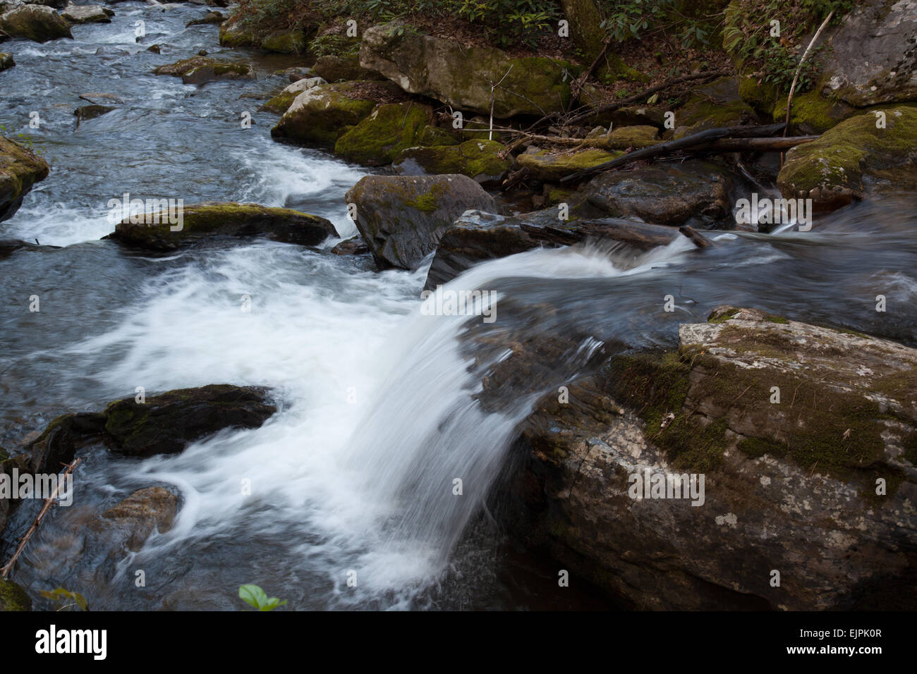Waterfall over rocks with moss Stock Photo - Alamy