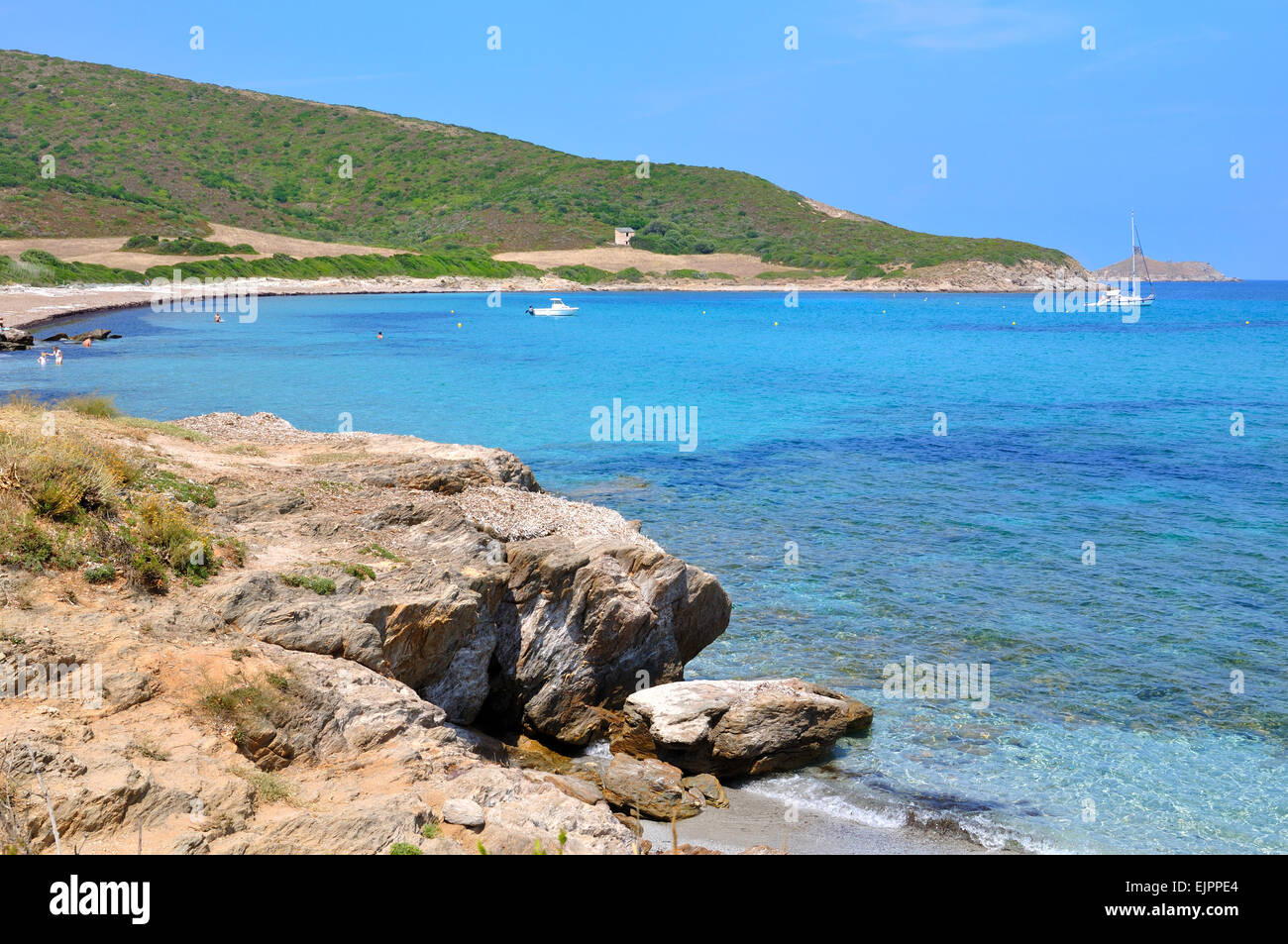 Blue beach at the foot of cliffs sea Stock Photo - Alamy
