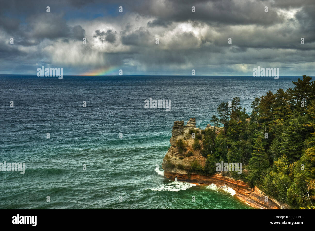 Partial rainbow with storm clouds over Lake Superior Stock Photo - Alamy