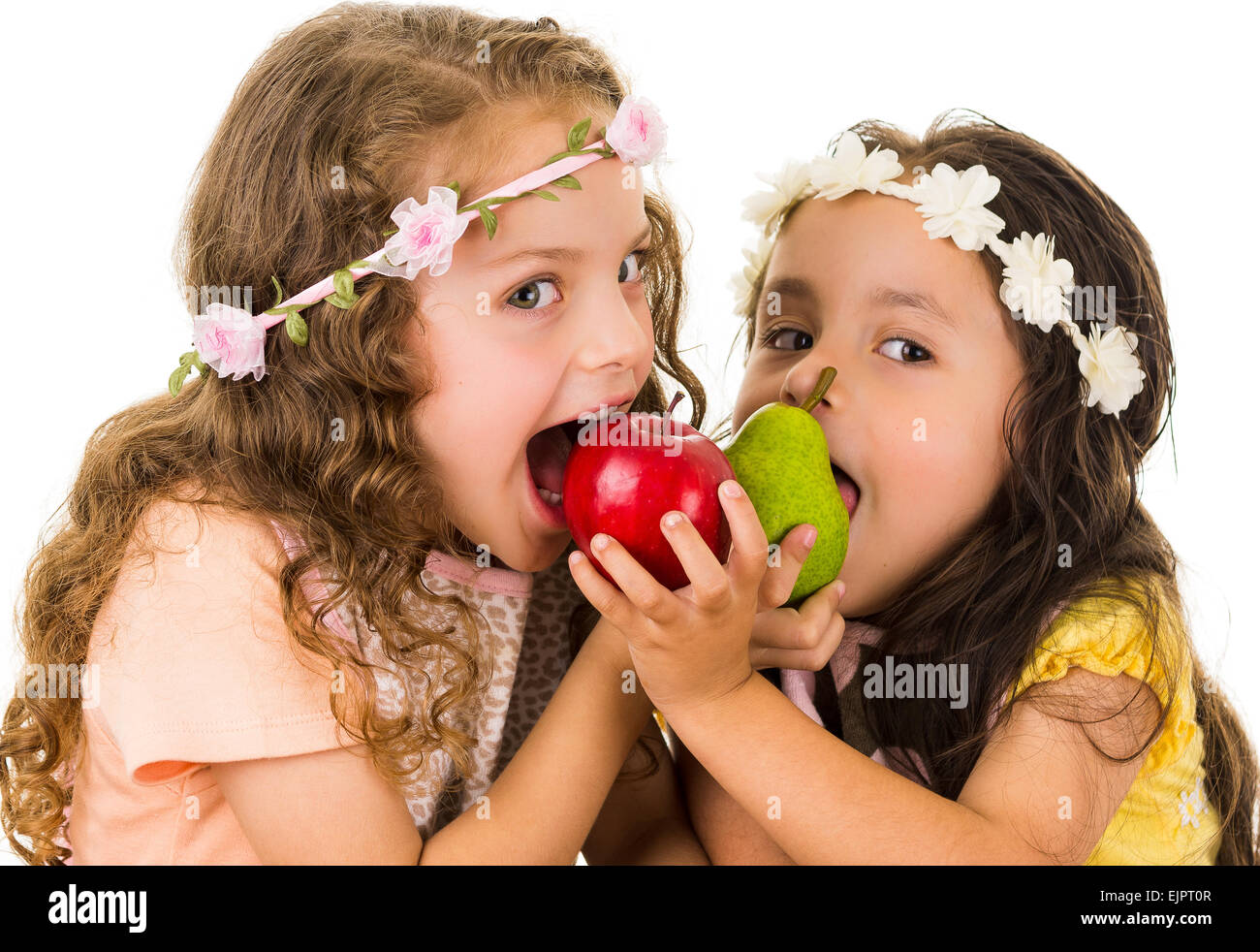 Beautiful healthy little girls eating delicious fresh fruits Stock ...