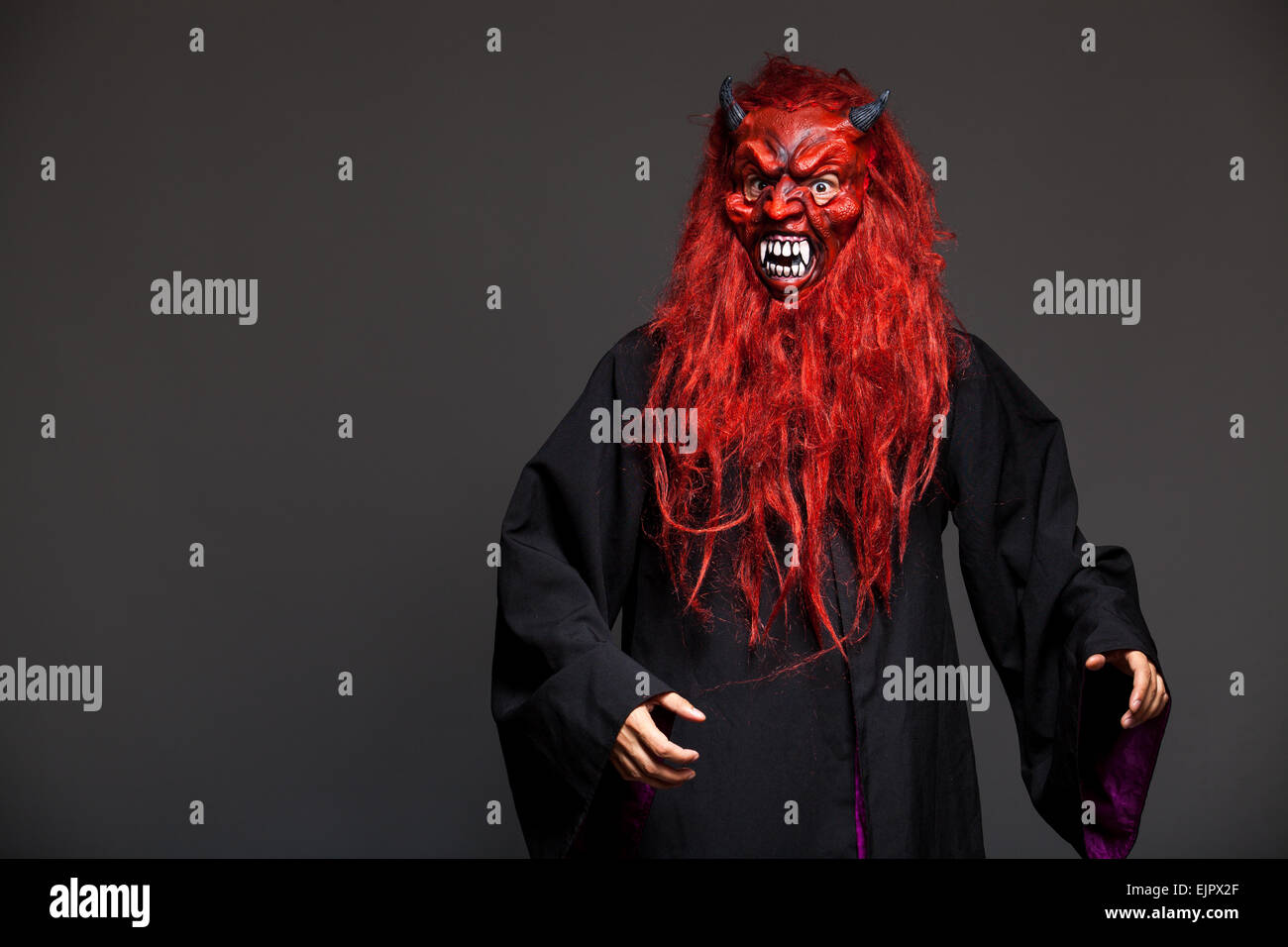 halloween monster with red face on dark background Stock Photo - Alamy