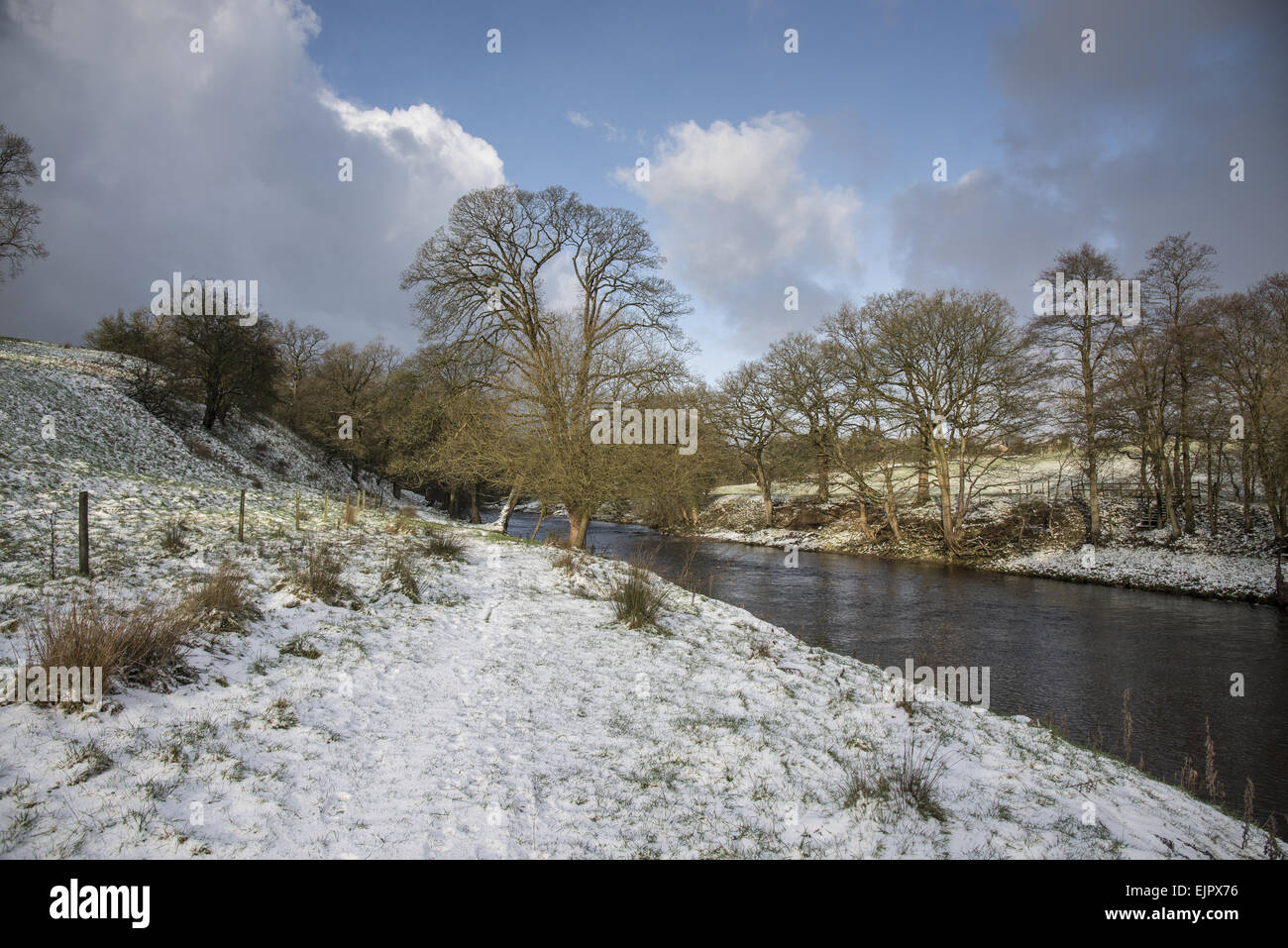 View of snow covered riverbank and river, River Hodder, Clitheroe ...