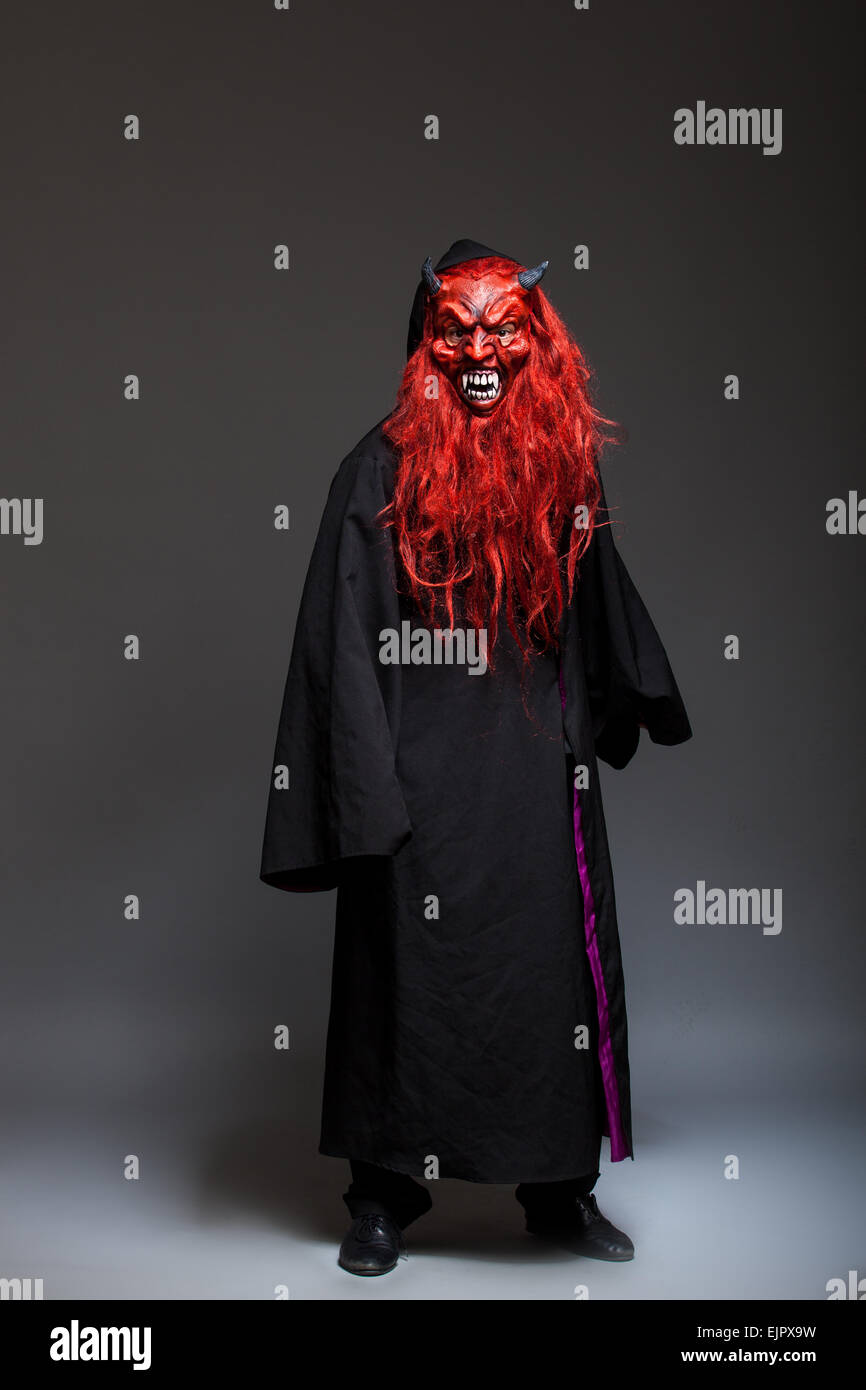 halloween monster with red face on dark background Stock Photo - Alamy