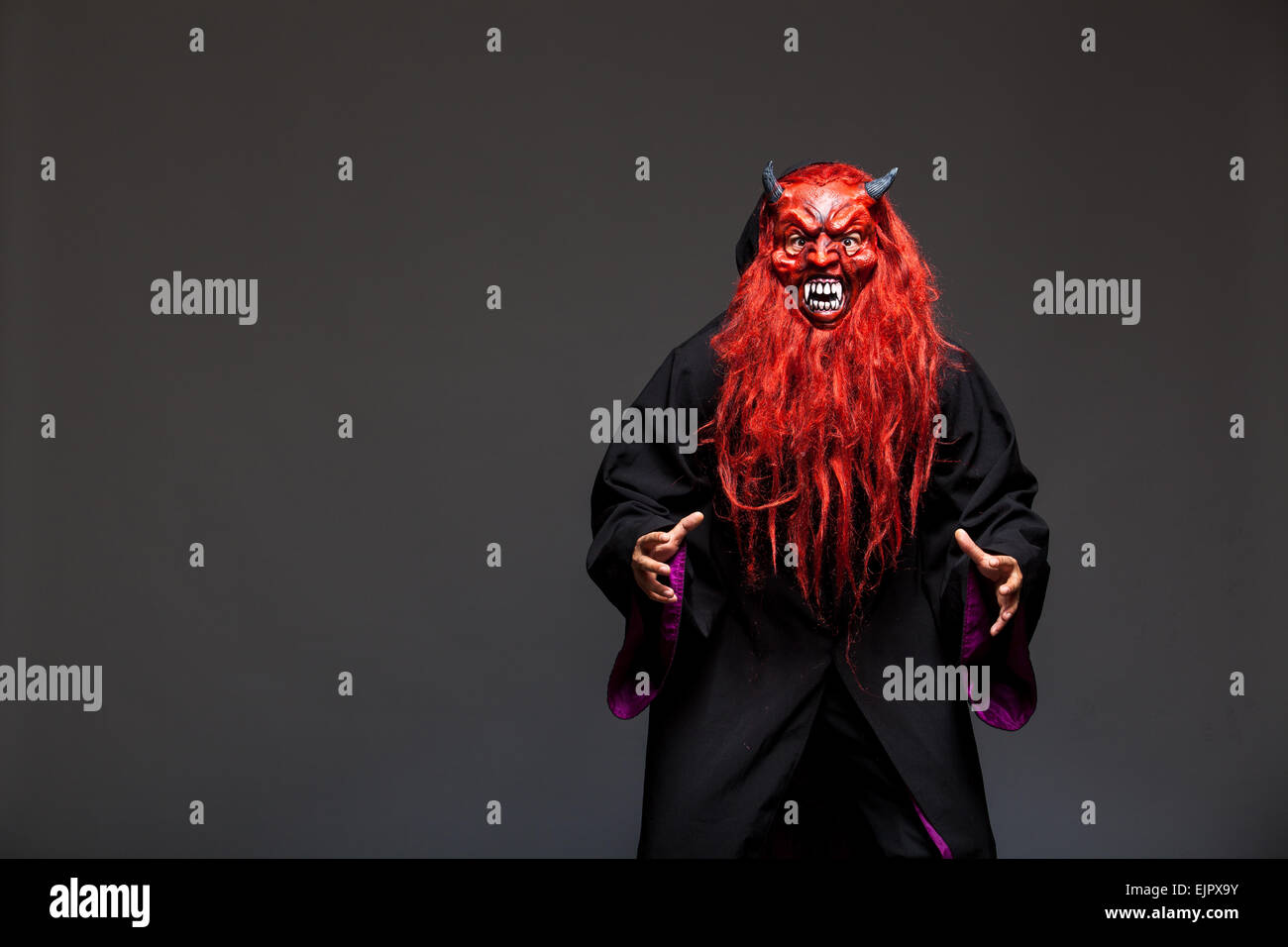 halloween monster with red face on dark background Stock Photo - Alamy