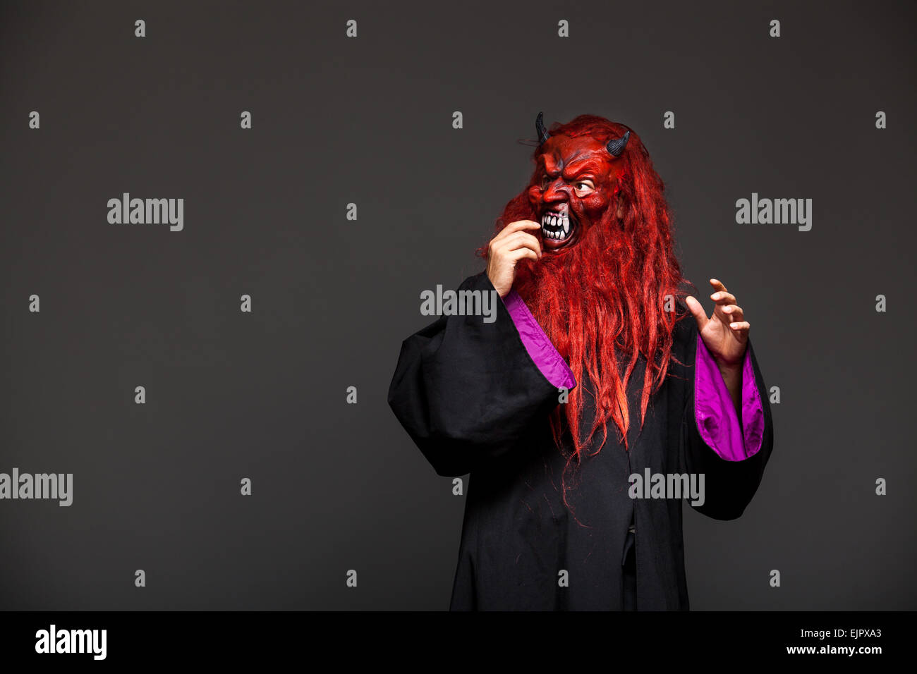 halloween monster with red face on dark background Stock Photo - Alamy