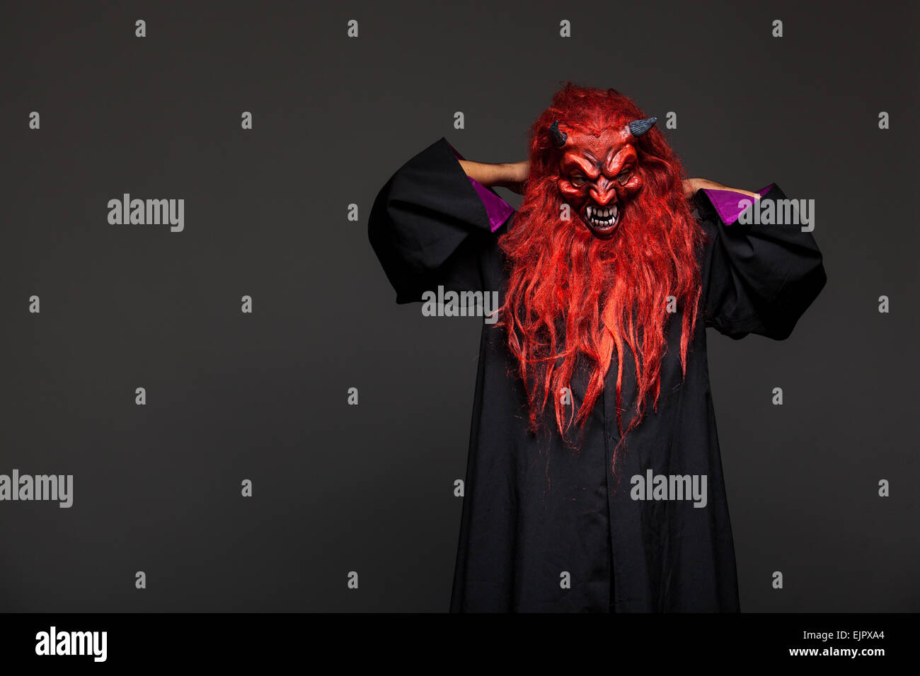 halloween monster with red face on dark background Stock Photo - Alamy