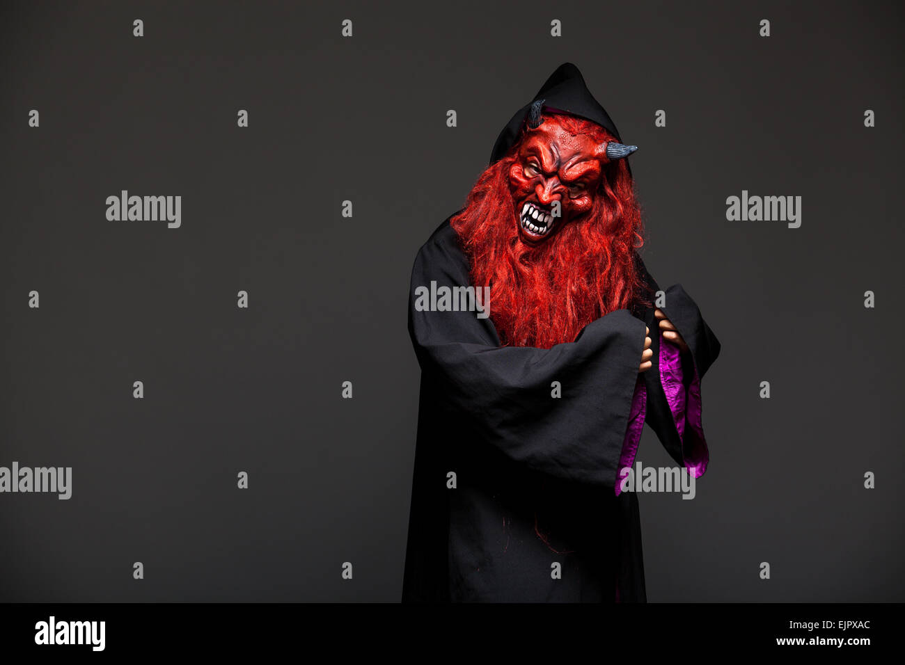 halloween monster with red face on dark background Stock Photo - Alamy