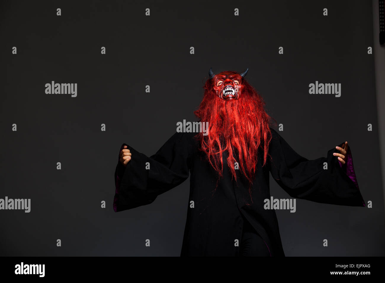 halloween monster with red face on dark background Stock Photo - Alamy