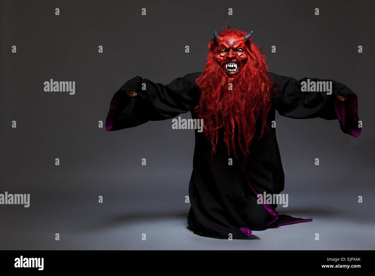 halloween monster with red face on dark background Stock Photo - Alamy