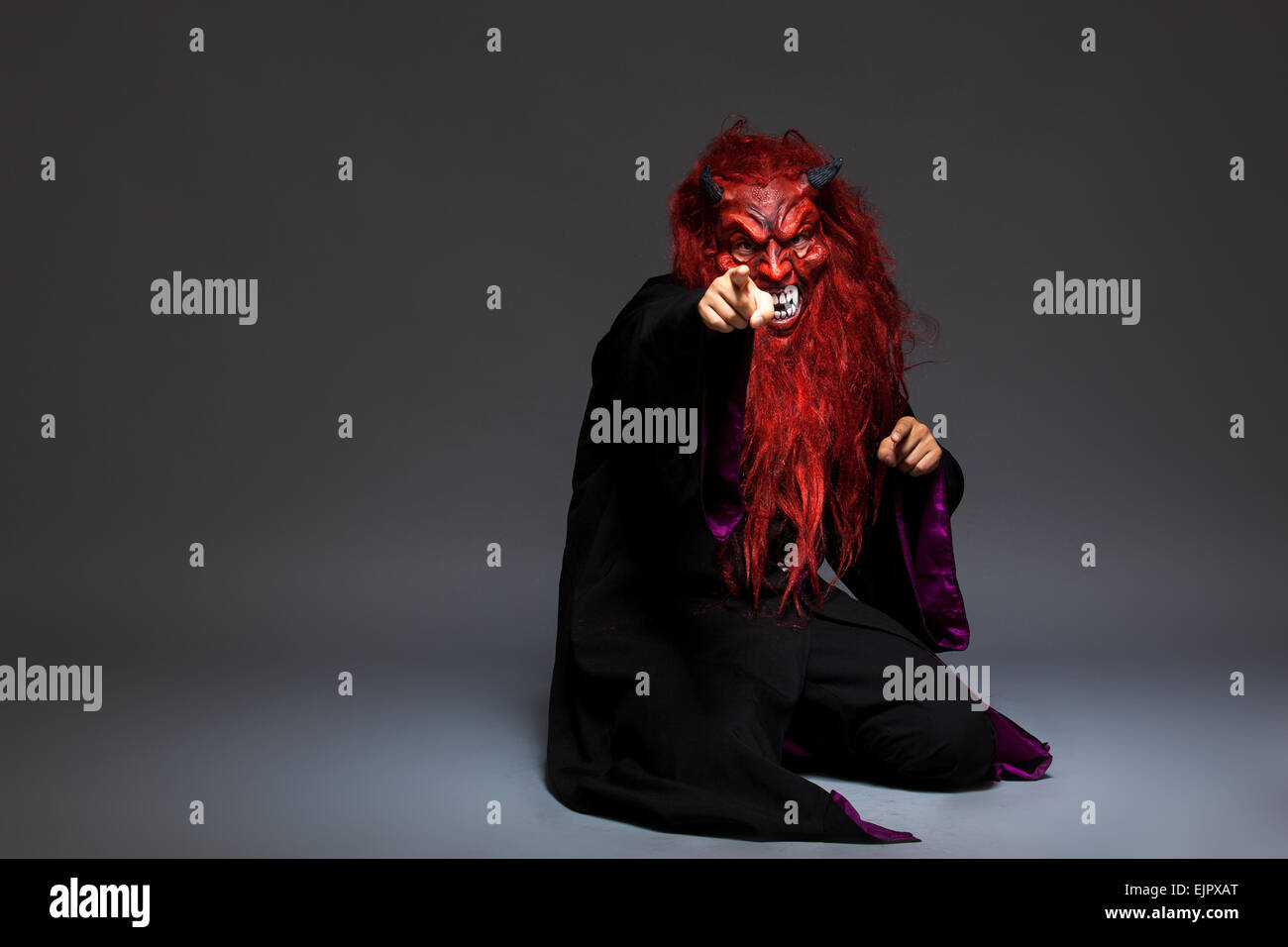 halloween monster with red face on dark background Stock Photo - Alamy