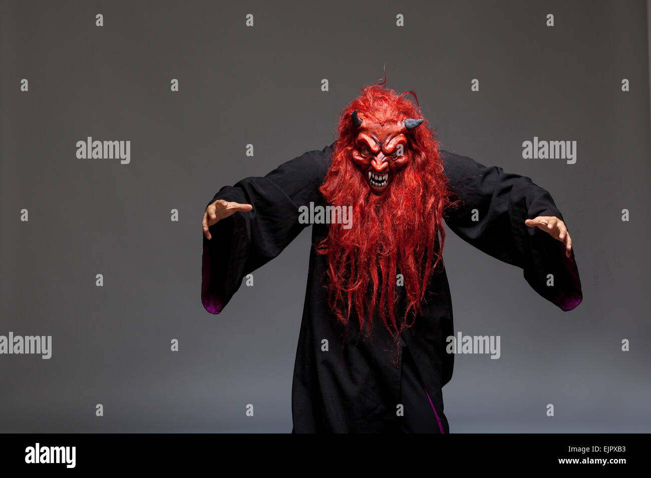 halloween monster with red face on dark background Stock Photo - Alamy