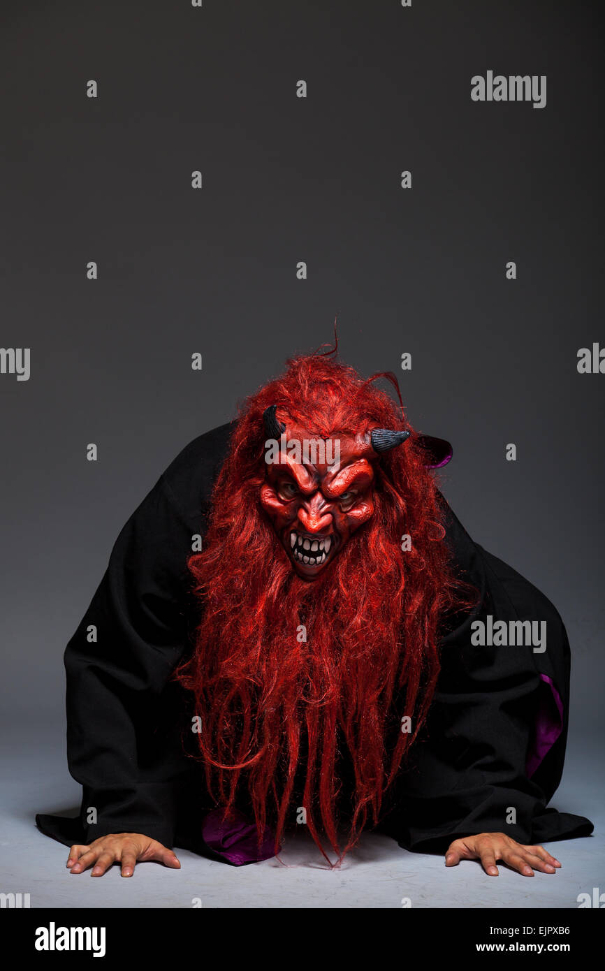 halloween monster with red face on dark background Stock Photo - Alamy