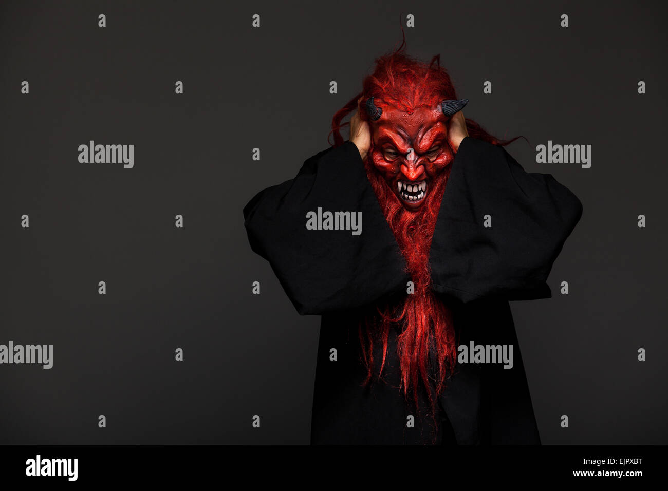halloween monster with red face on dark background Stock Photo - Alamy