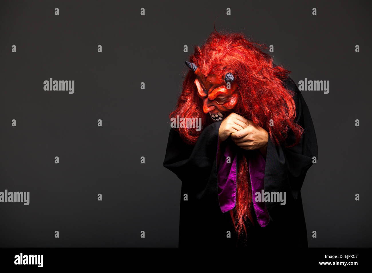 halloween monster with red face on dark background Stock Photo - Alamy