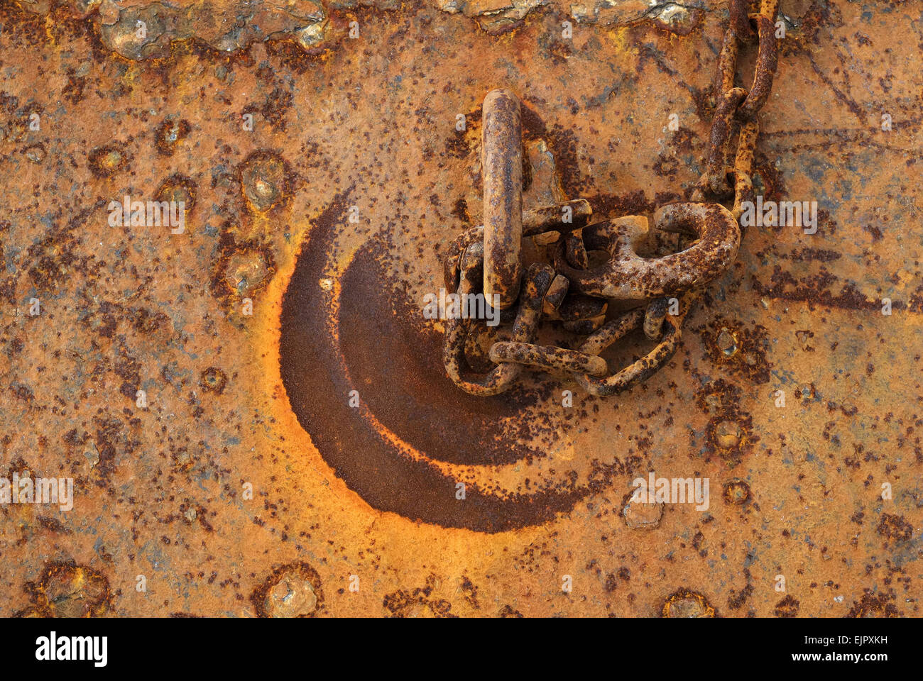 Close-up of rusted metal chain and loop in harbour, Granville, Manche ...