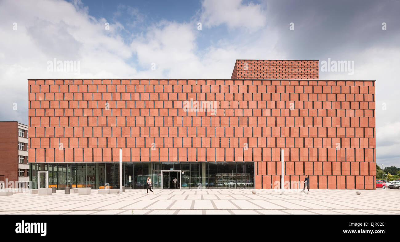 Front elevation of main entrance and façade with pedestrians ...