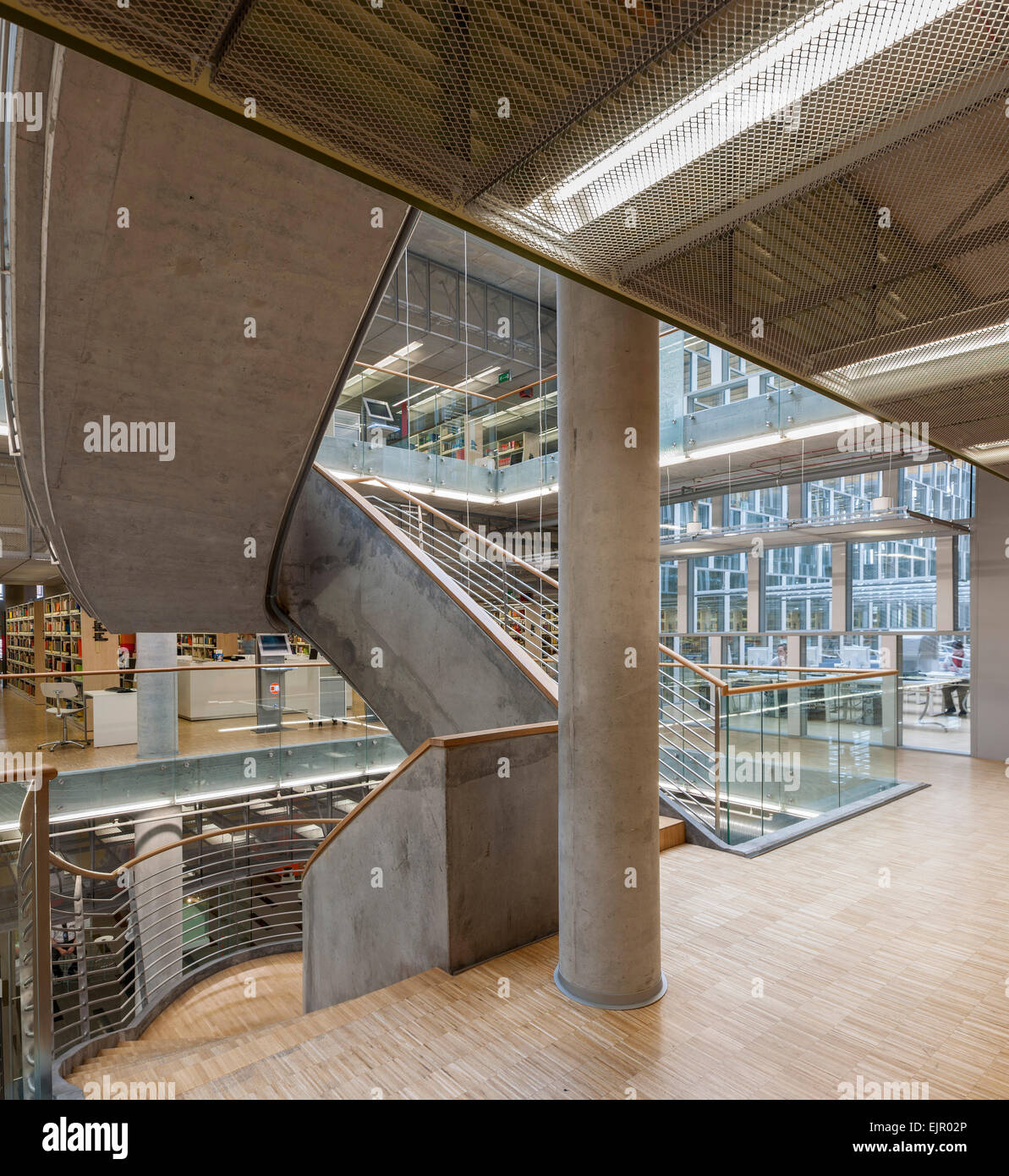 Detail view showing concrete column, staircase fluorescent lights ...