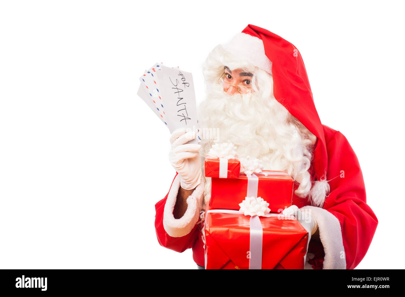 santa claus holding letters from kids and gifts on white background ...