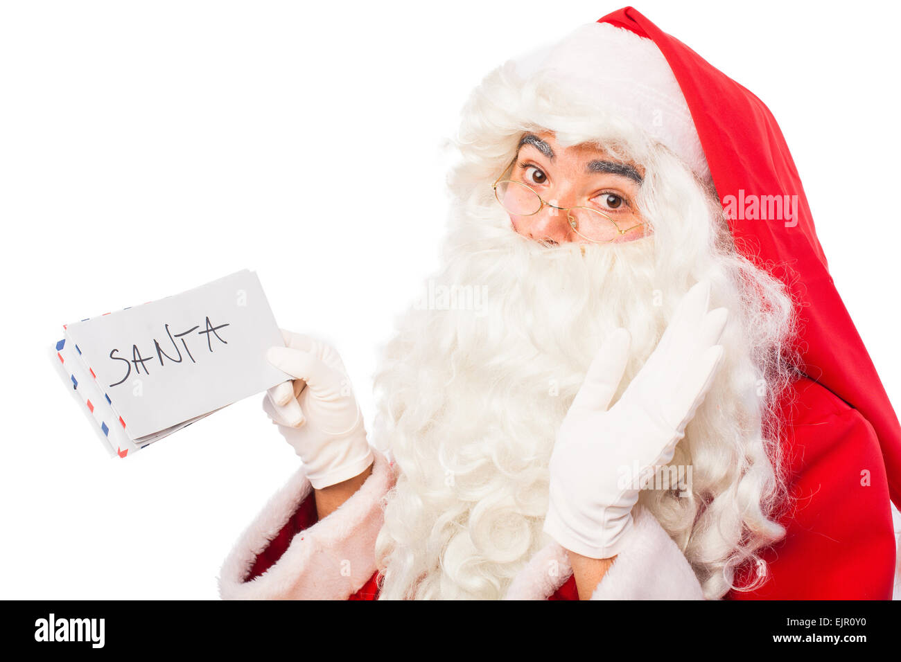 santa claus holding letters from kids on white background Stock Photo ...