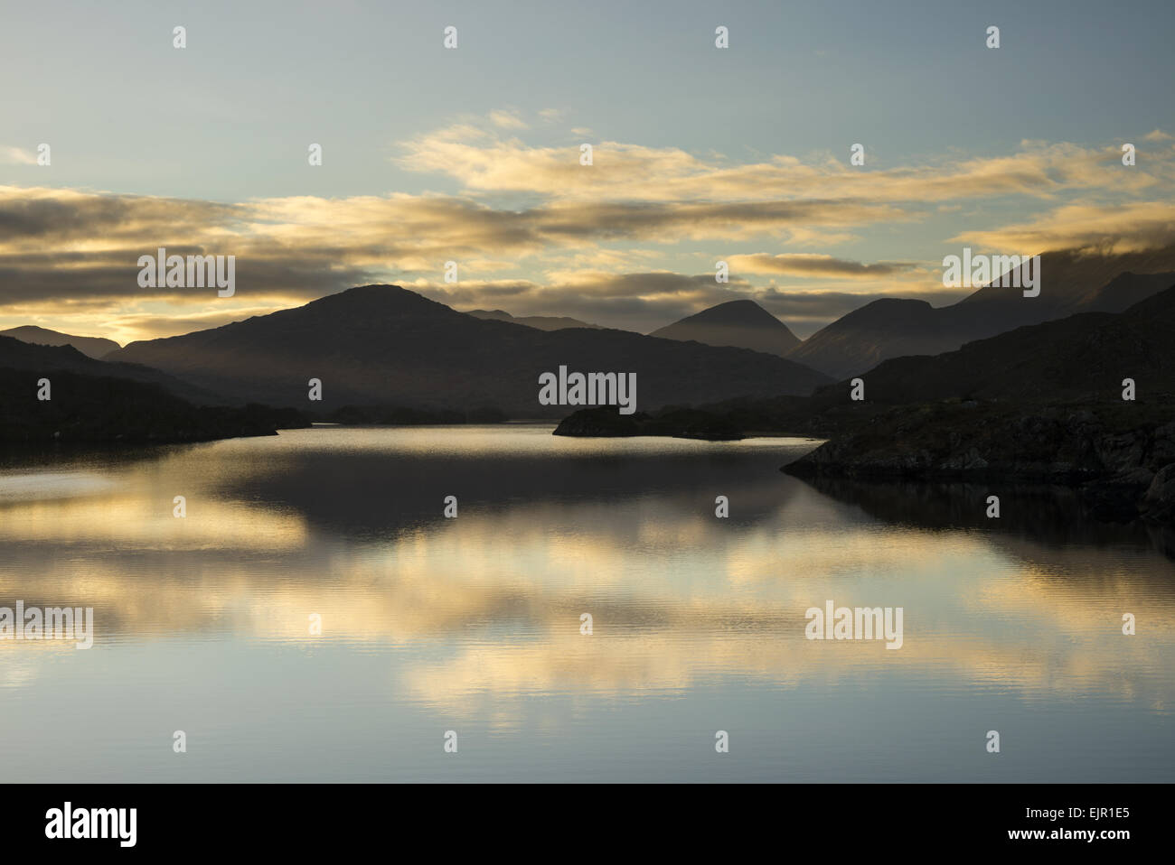 View of lake and mountains at sunset, Upper Lake, Lakes of Killarney ...