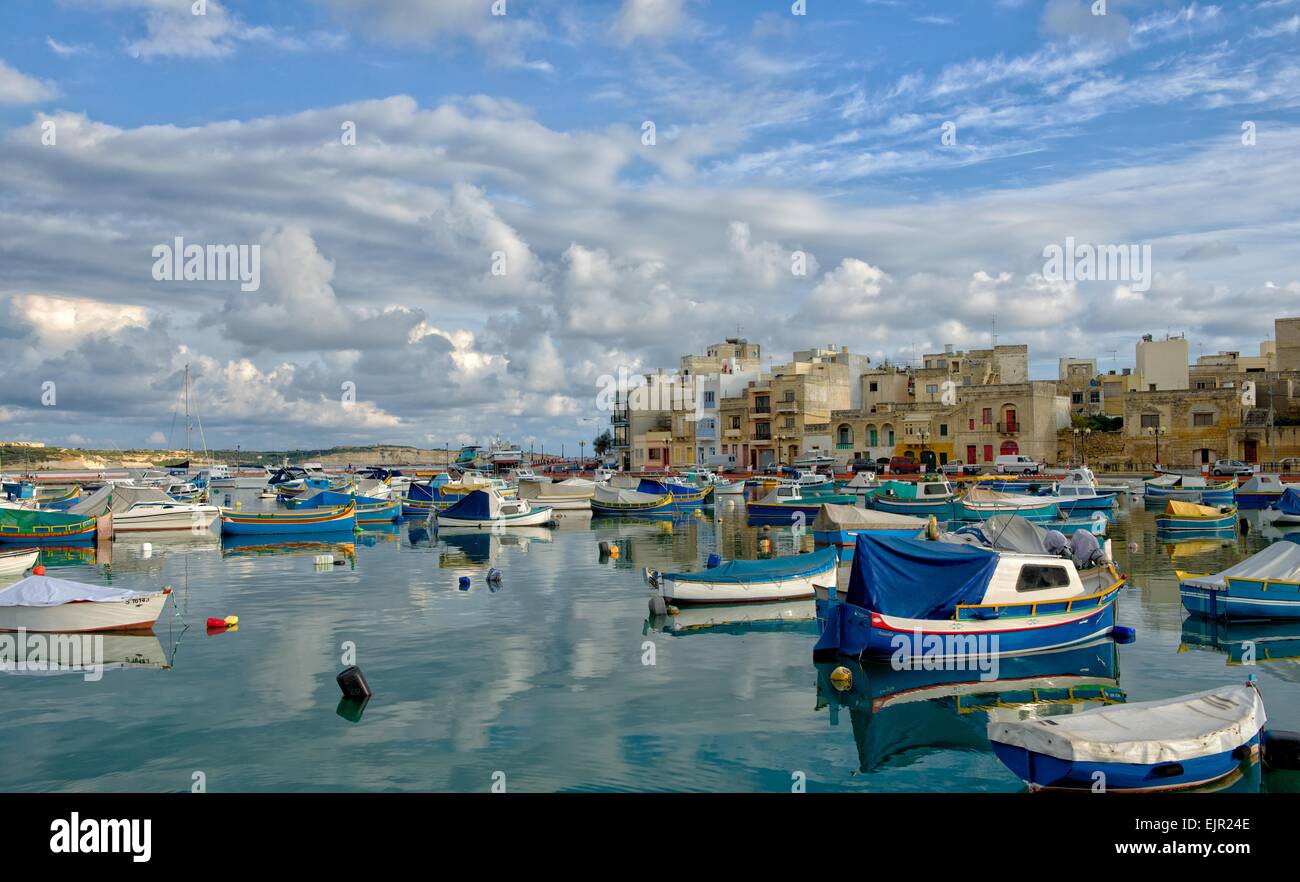 Malta Marsaxlokk village and native fishing boats luzzu Stock Photo - Alamy