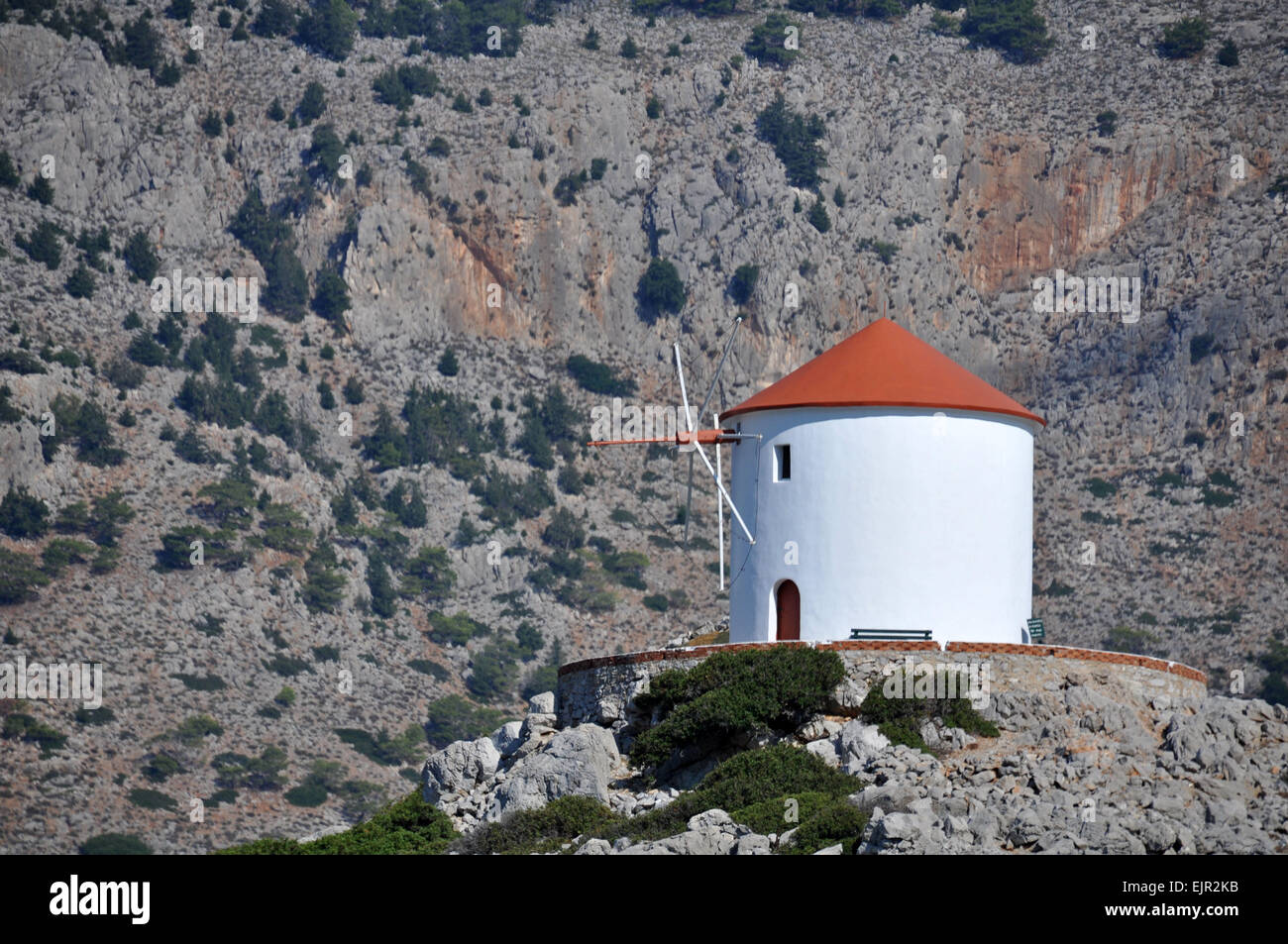 Traditional windmill overlooking Panormitis Monastery on the Greek ...