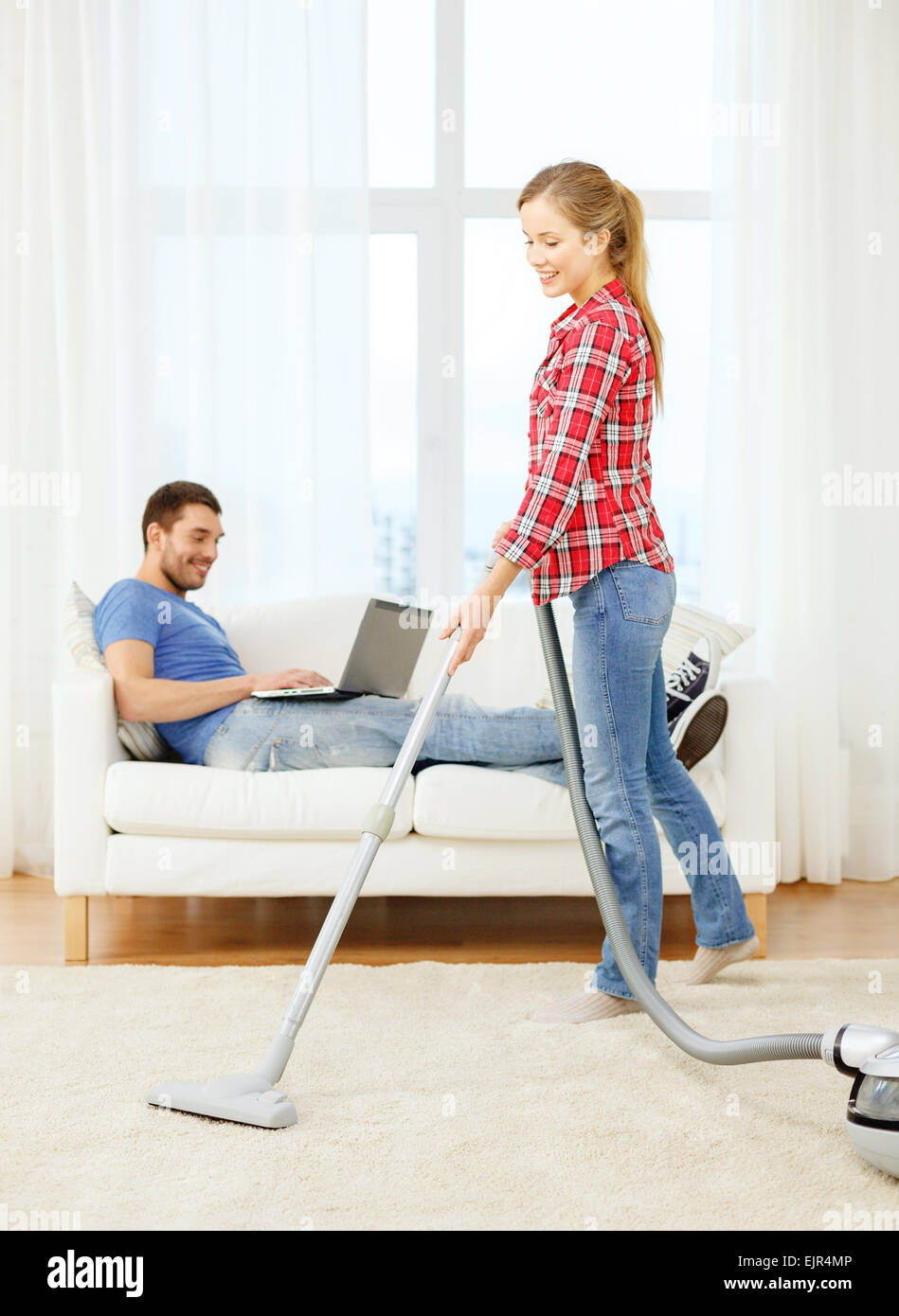 Woman hoovering man sofa hi-res stock photography and images - Alamy