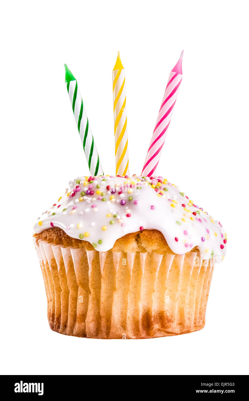 Birthday cupcake with three colored candles with a white background ...