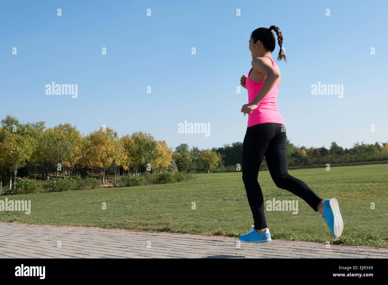Woman jogging low angle hi-res stock photography and images - Alamy