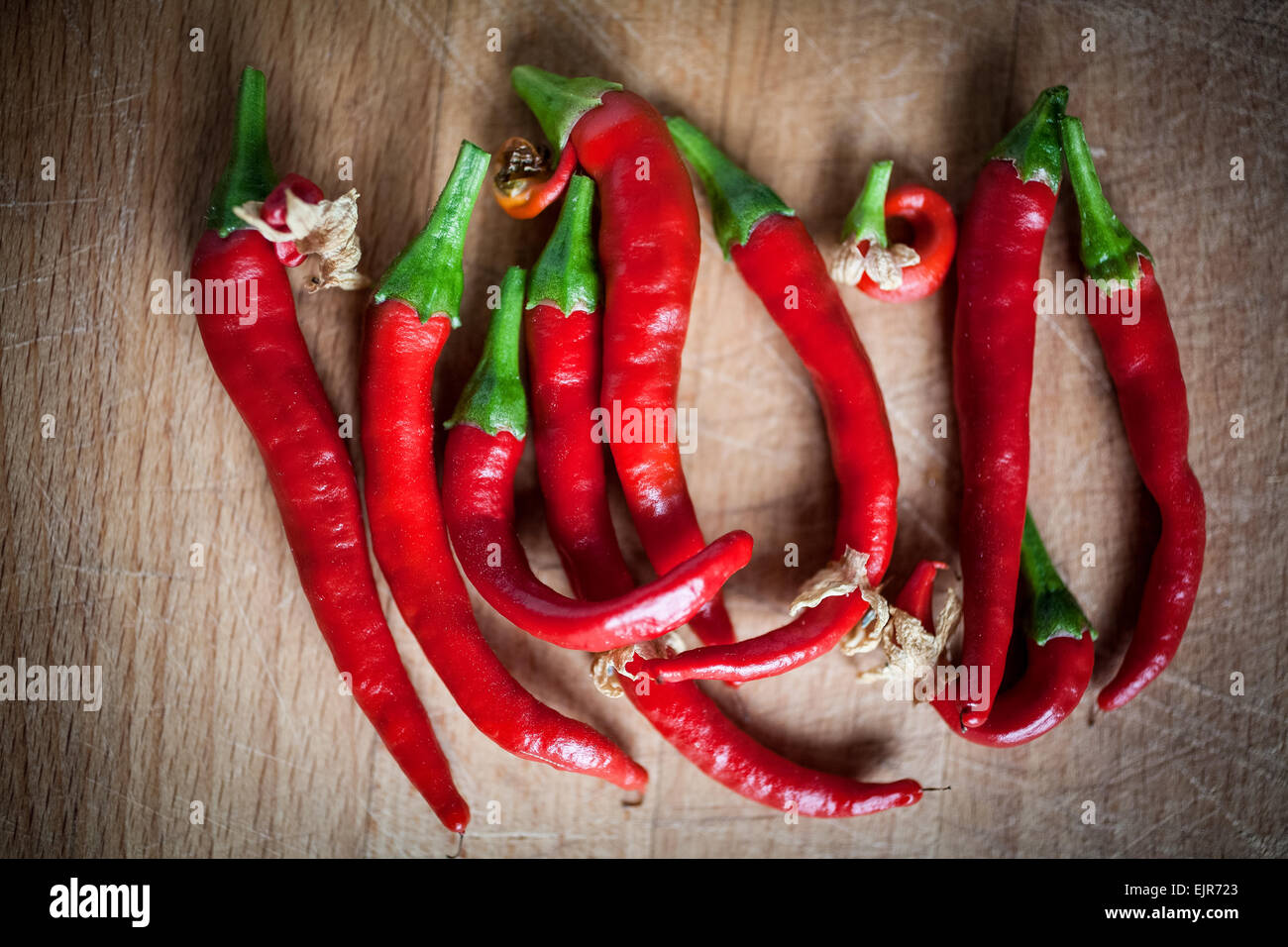 Red chilies on a table Stock Photo - Alamy