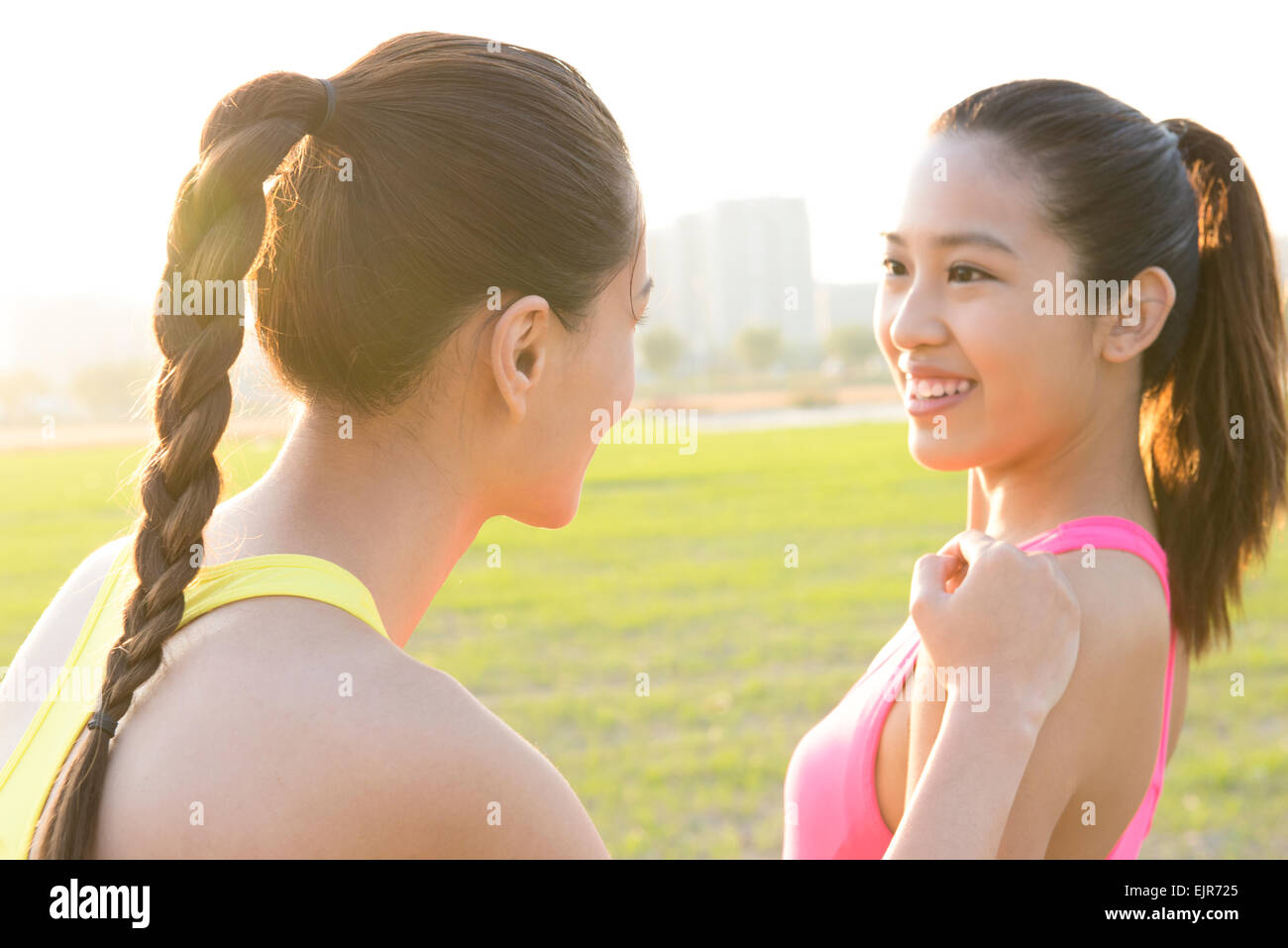 Girlfriends exercising together Stock Photo - Alamy