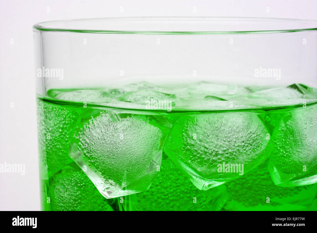 Floating ice in green mint drink closeup Stock Photo - Alamy
