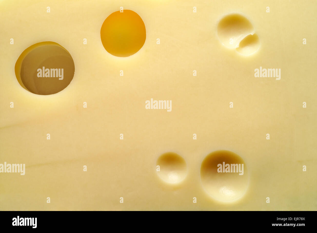 Emmentaler cheese closeup Stock Photo - Alamy