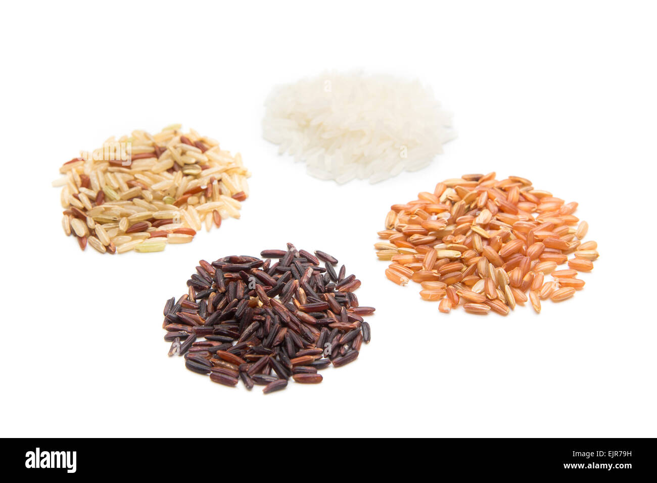 piles of brown and white variety rice on white background Stock Photo ...