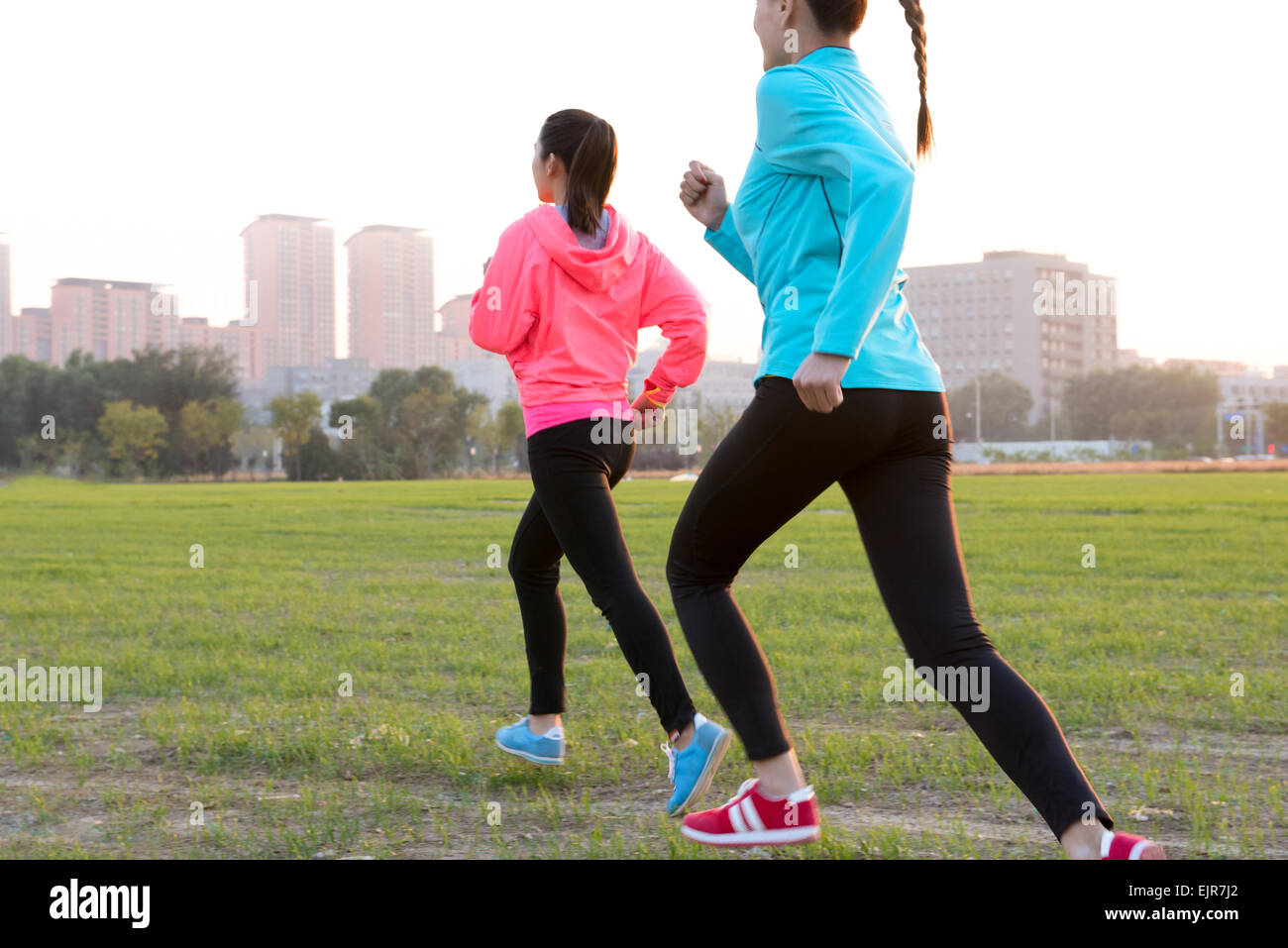 Young women jogging Stock Photo - Alamy