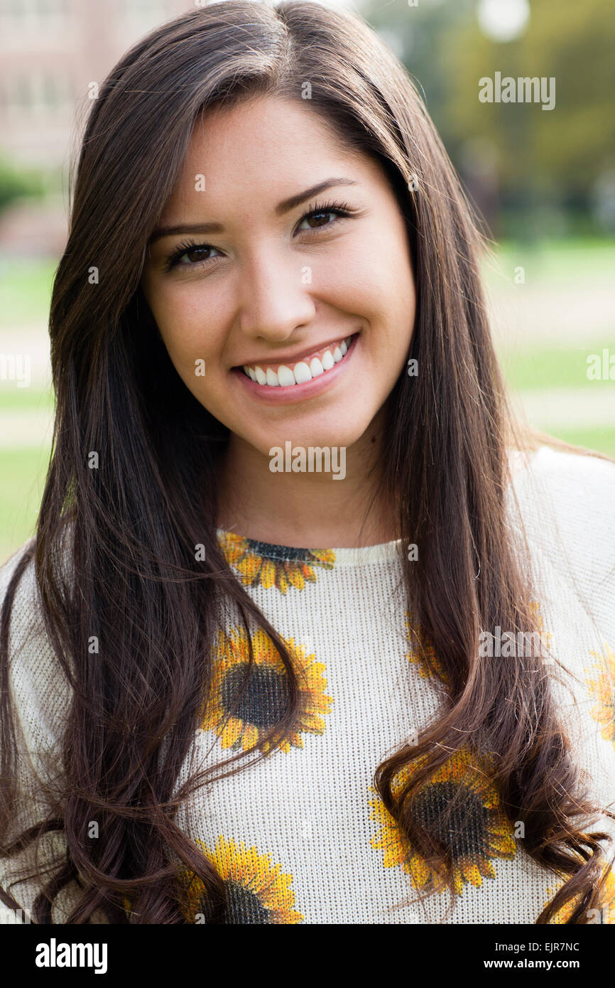 Smiling Hispanic woman standing outdoors Stock Photo - Alamy
