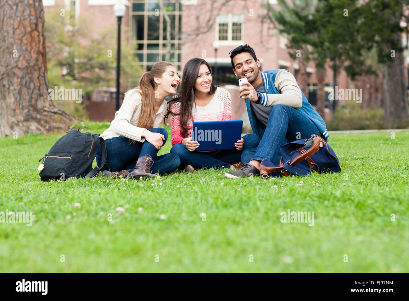 Students taking cell phone photograph on campus Stock Photo - Alamy
