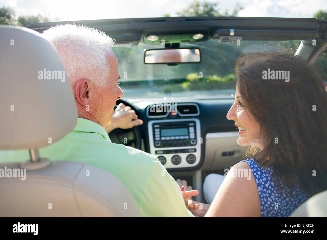 Older Caucasian couple driving in convertible Stock Photo - Alamy