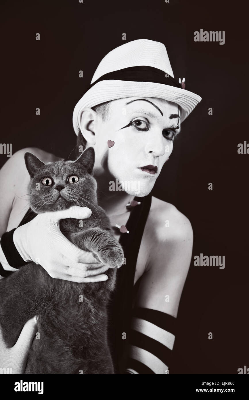 Portrait of the mime with a gray British cat Stock Photo - Alamy